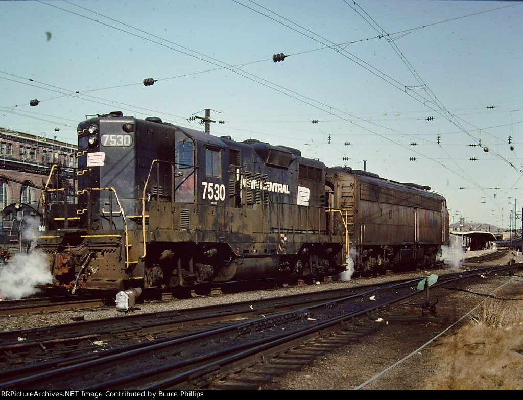 Penn Central GP9 pairs with Amtrak E8A 307 for Eastbound Passenger Service to Boston